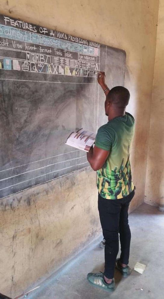 Teacher in Ghana Teaches Students How To Use The Computer Program ...